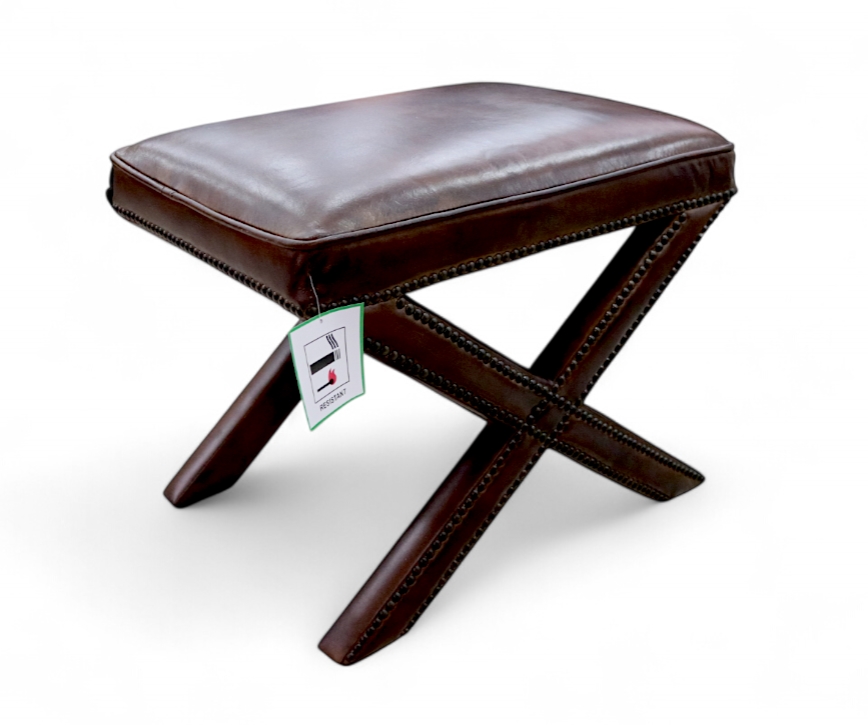 Experience Timeless Luxury with a Studded Cross Leather Pouffe